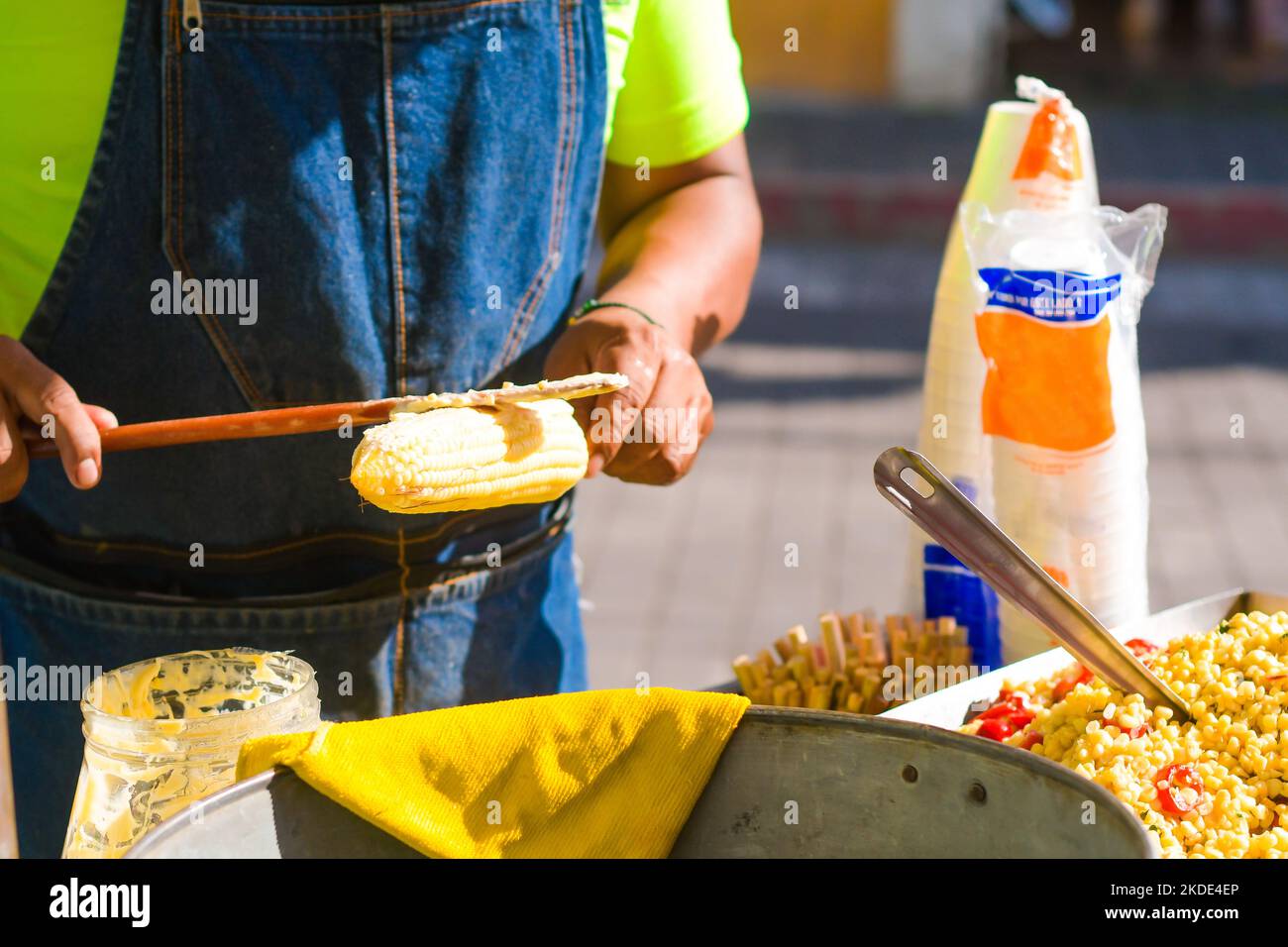 Preparing elotes, traditional Mexican street food Stock Photo - Alamy