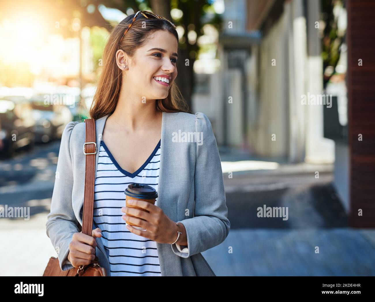 On her way to work. an attractive young woman on her morning commute to ...