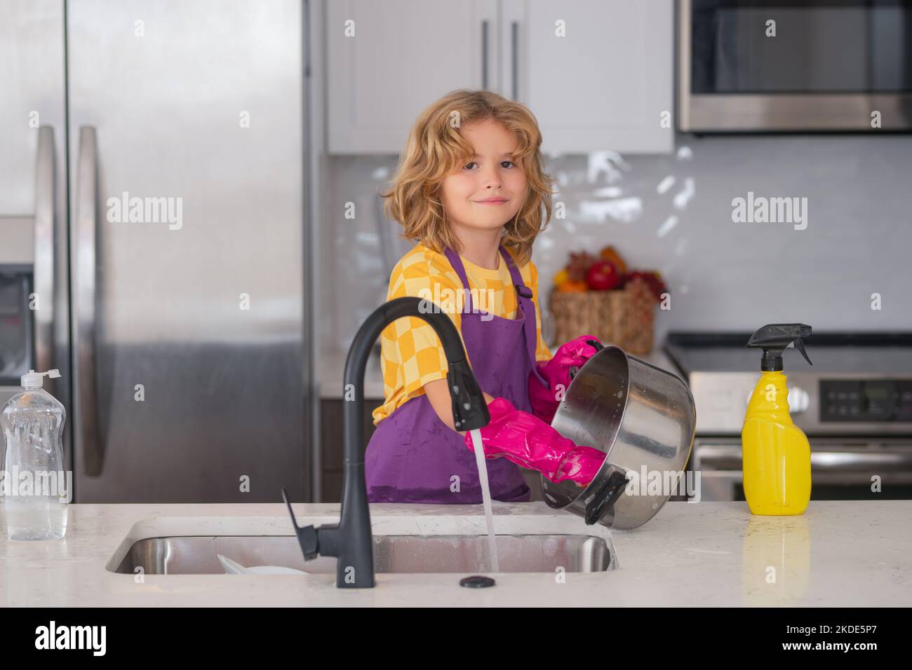 Little kid cleaning at home. Child doing housework having fun. Cute ...