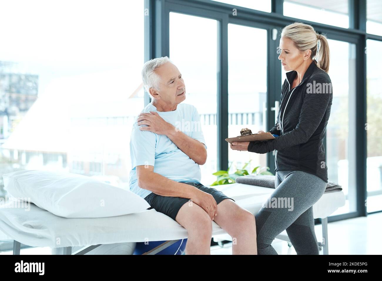 Can you explain the pain. a senior man consulting with his ...