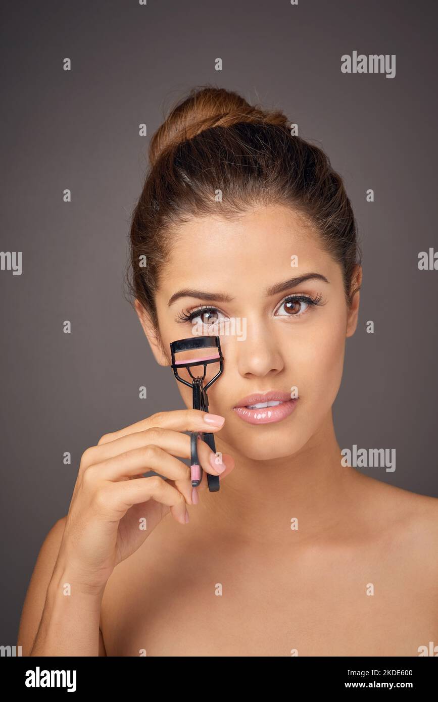 Her shortcut to luscious lashes. Portrait of a beautiful young model ...