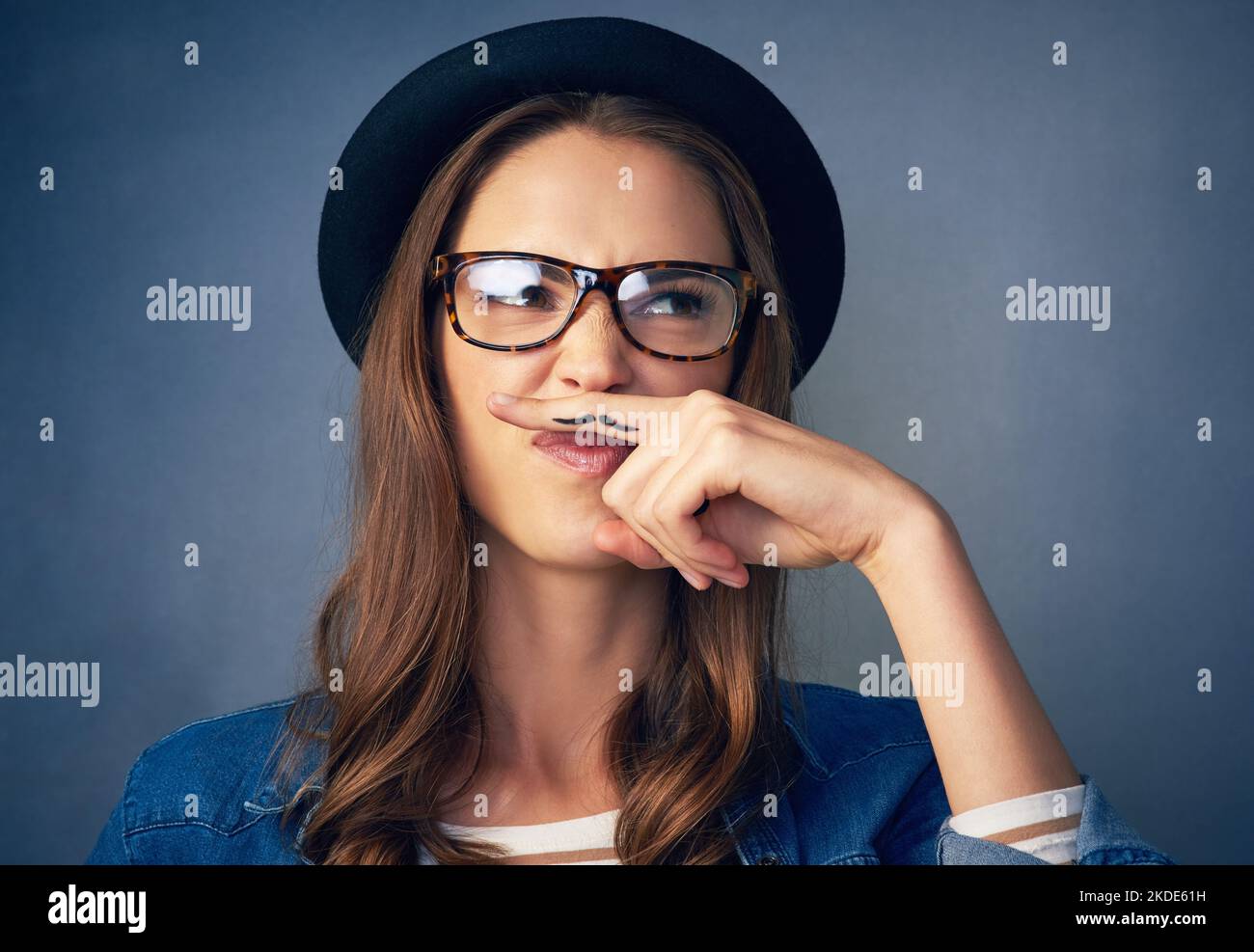 May the stache be with you. a comical young woman posing with a ...