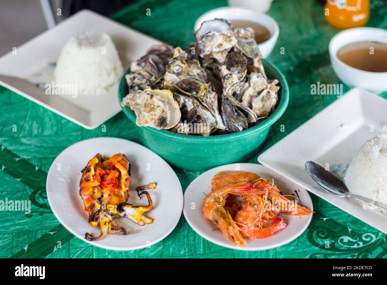 Seafood lunch of oysters, squid and shrimps in Iloilo, Philippines ...