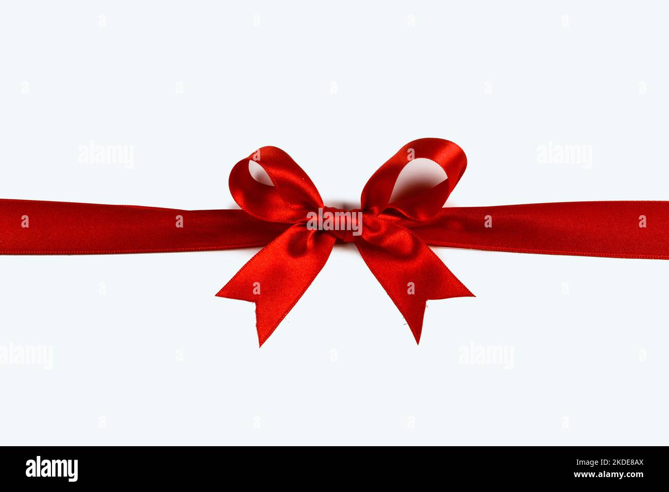 Elegant satin red ribbon bow isolated on white background Stock Photo ...