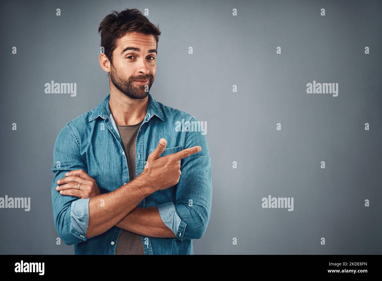 Direct your attention over here...Studio shot of a handsome young man ...