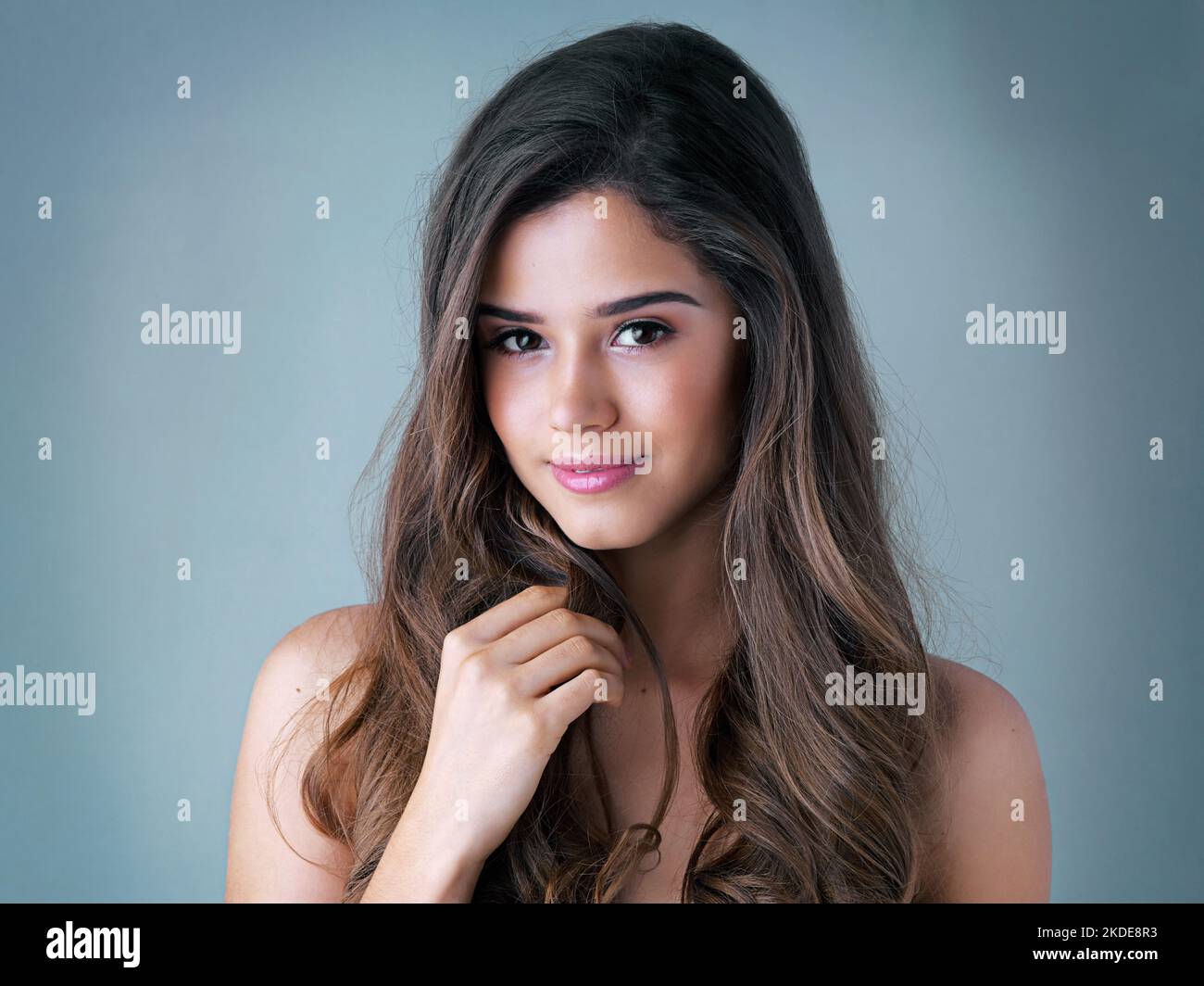 Good hair is underrated. Studio shot of a beautiful young woman posing ...