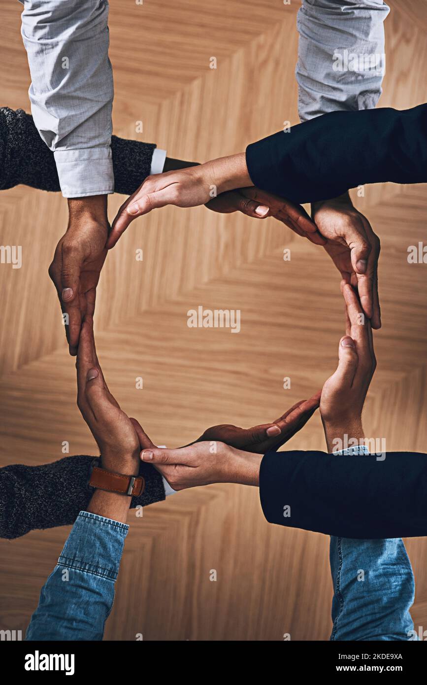 Coming together as one. High angle shot of a group of unidentifiable ...