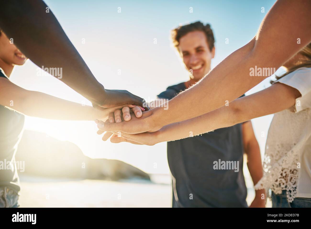 Hands on in keeping their friendship tight. a group of young joining ...