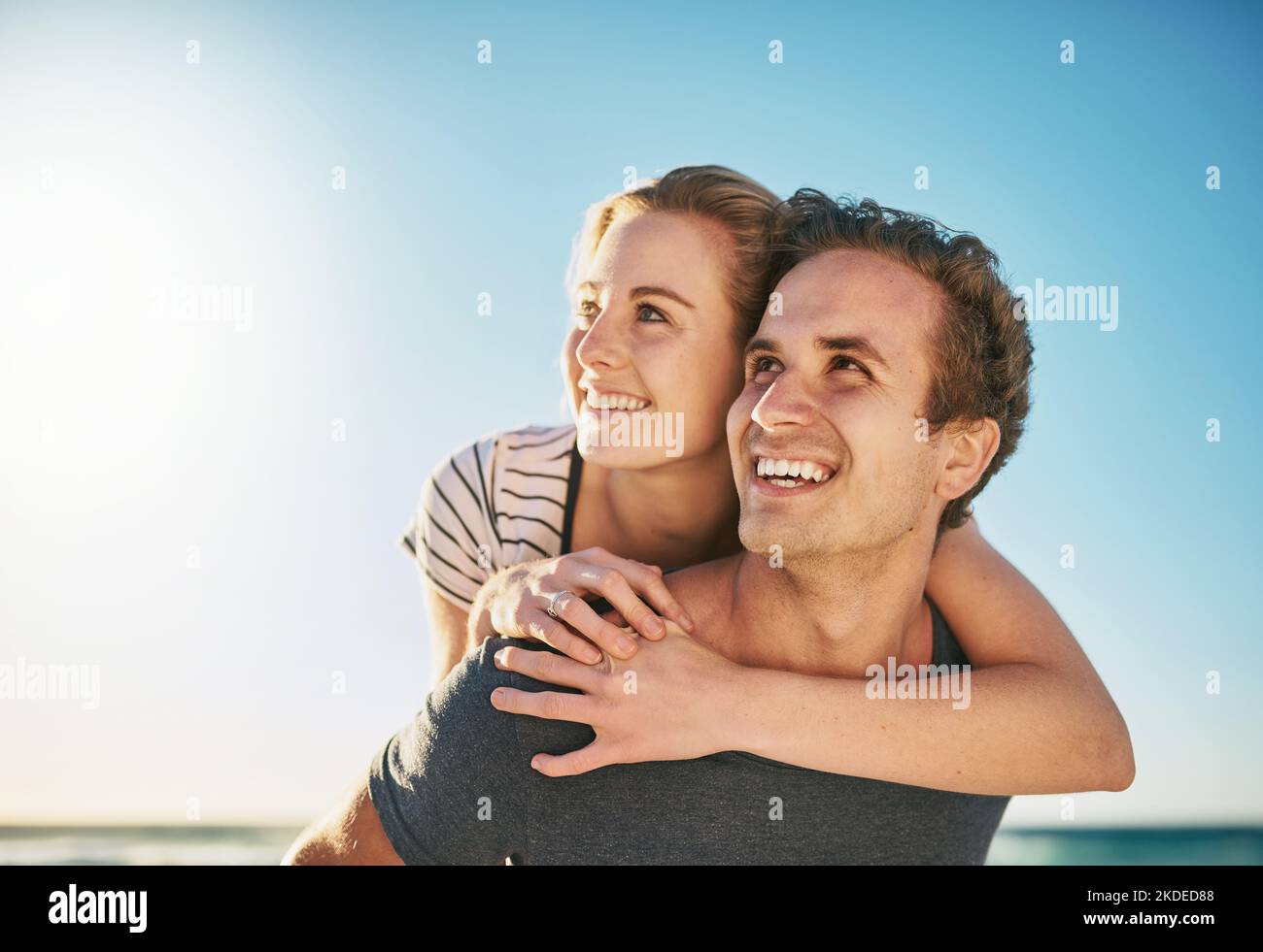Brighter days are here again. a happy young couple enjoying a piggyback ...