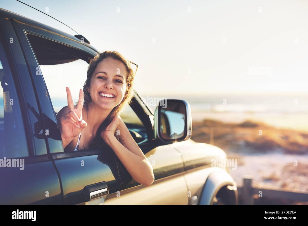 Always is a good time for a roadtrip. Cropped portrait of an attractive ...