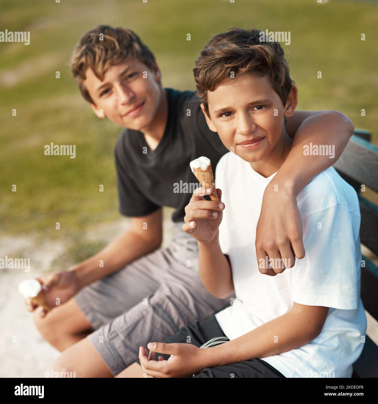 Veggies tomorrow, ice-cream today. Portrait of two happy brothers ...