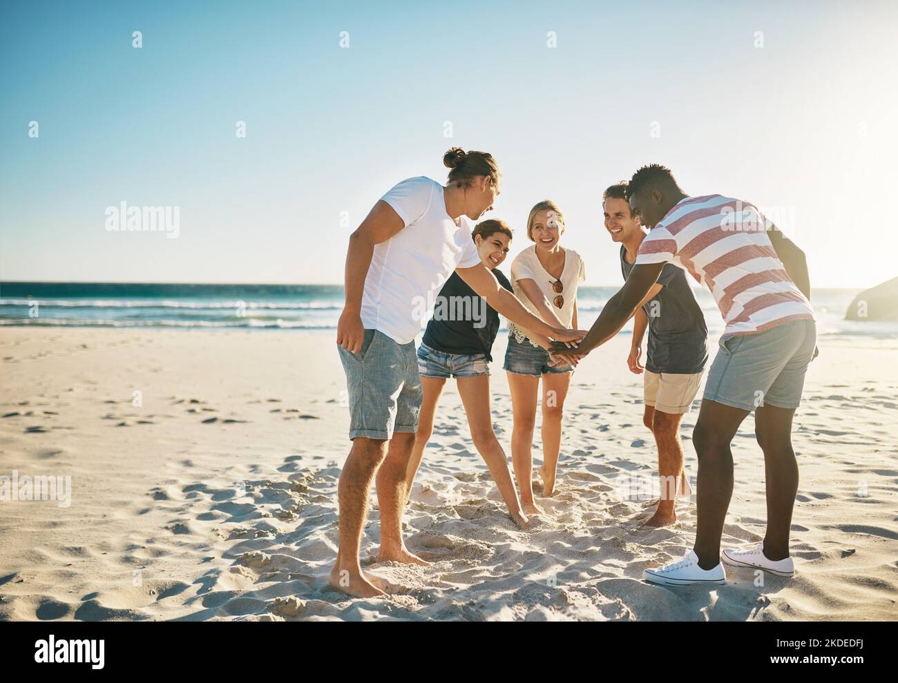 Well be friends forever and a day. a group of young joining their hands ...