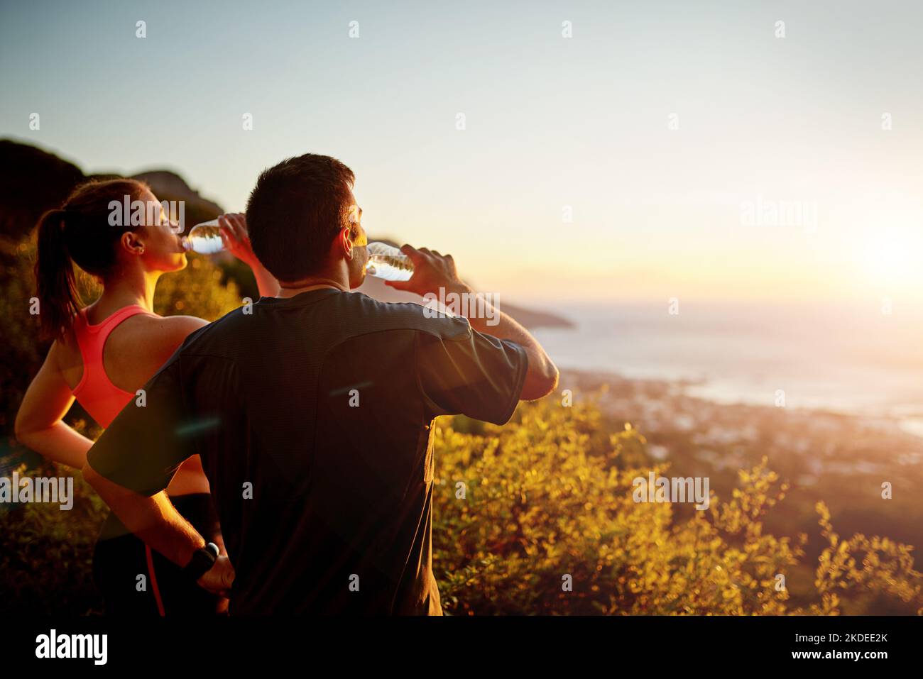 Cooling down with a view. a sporty young couple taking a break while ...