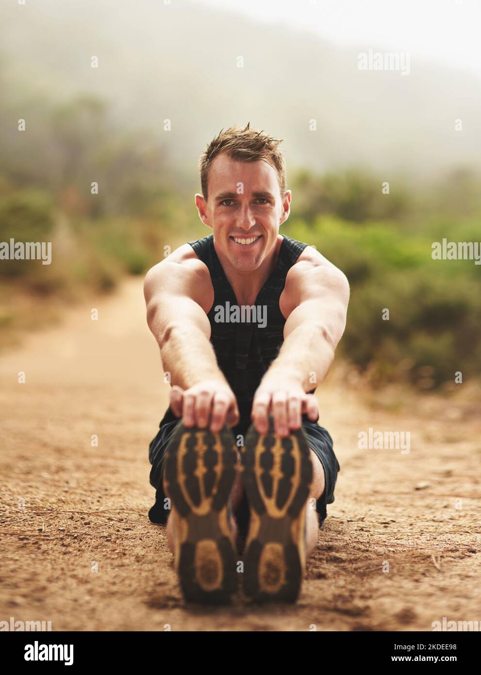 Ensure you warmup properly to prevent injury. Portrait of a sporty ...