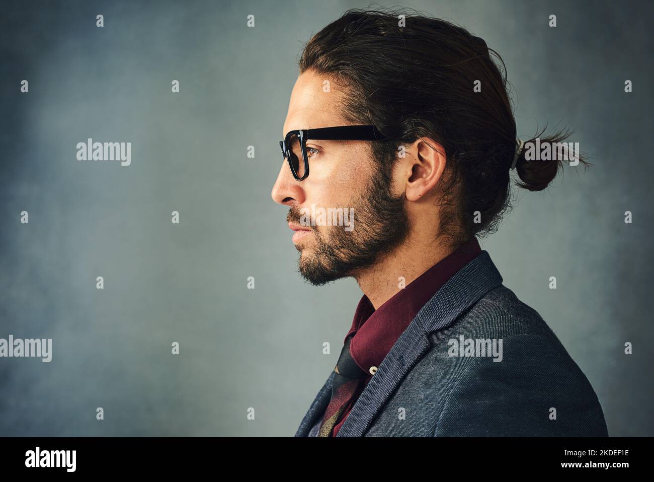 Proflie on style. Studio profile shot of a stylishly dressed handsome ...