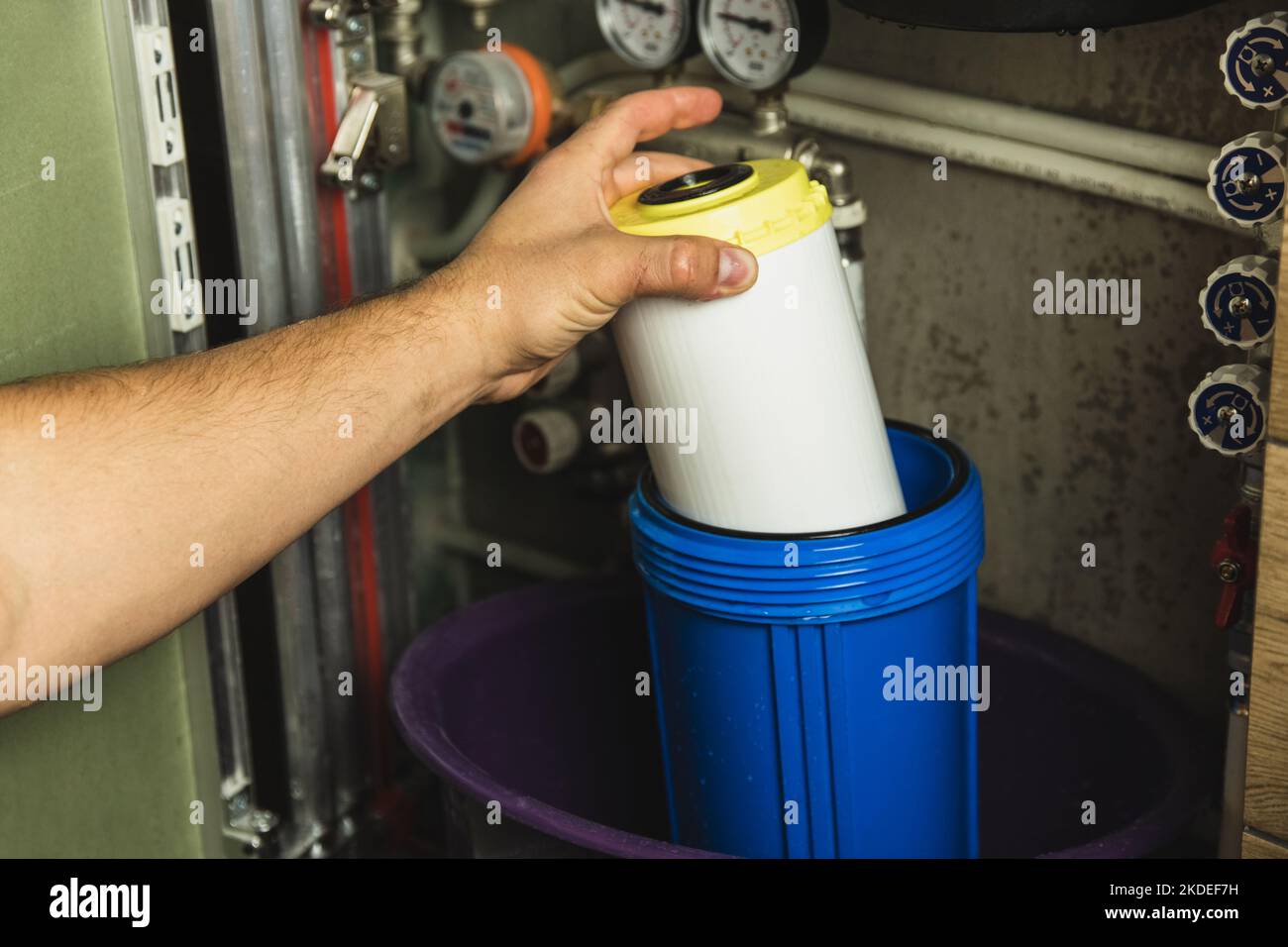 Replacing the filter element in the home water purification system ...