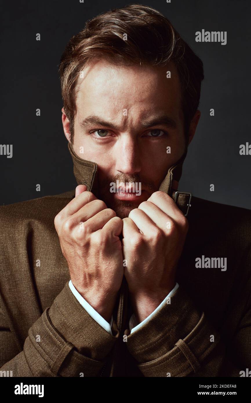 The king of cool. Studio portrait of a handsome young man posing ...