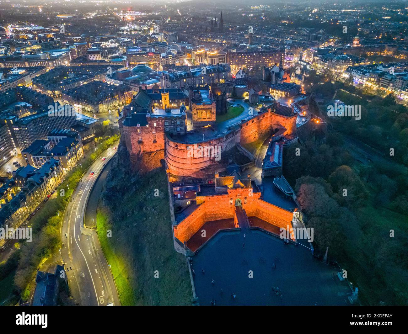 Aerial view at dusk of Edinburgh Castle illuminated in red, Edinburgh ...