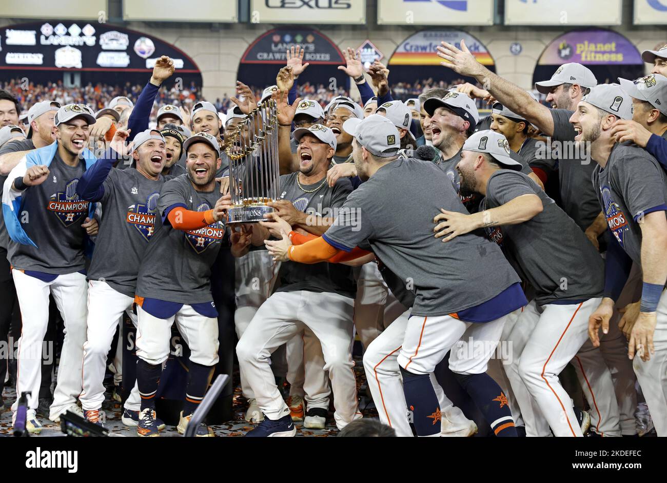 Houston Astros players celebrate with the trophy as they win their ...