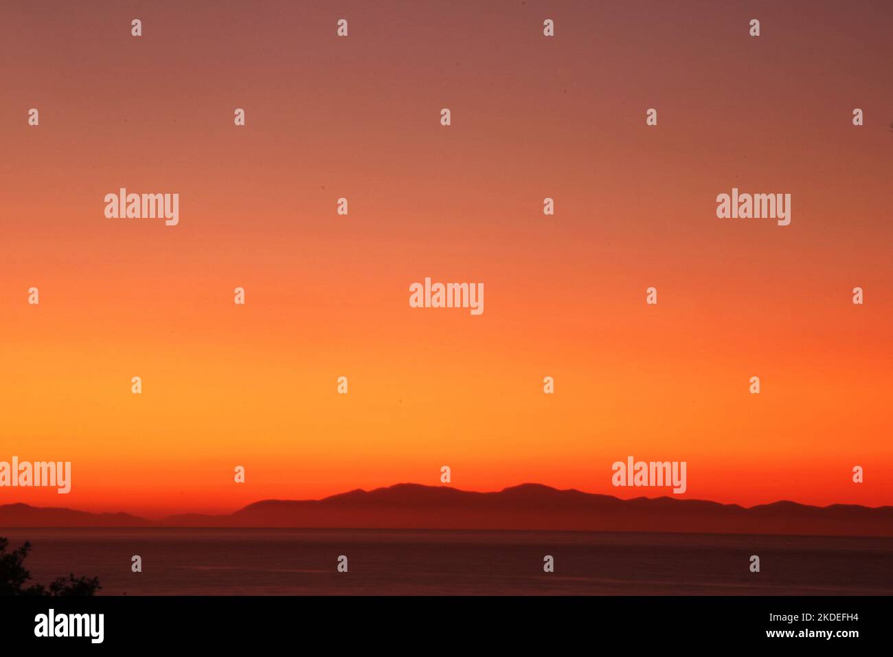 Red sunset at coast Stock Photo - Alamy
