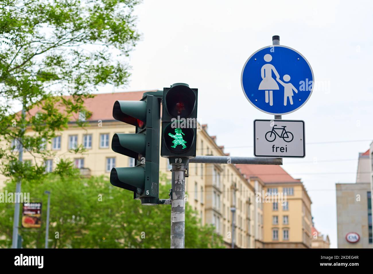 Traffic light for pedestrians with the figure of a walking man, lights ...