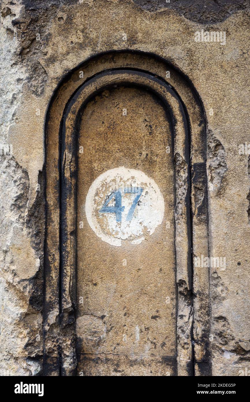 Number 47 house number on a stone wall Stock Photo - Alamy