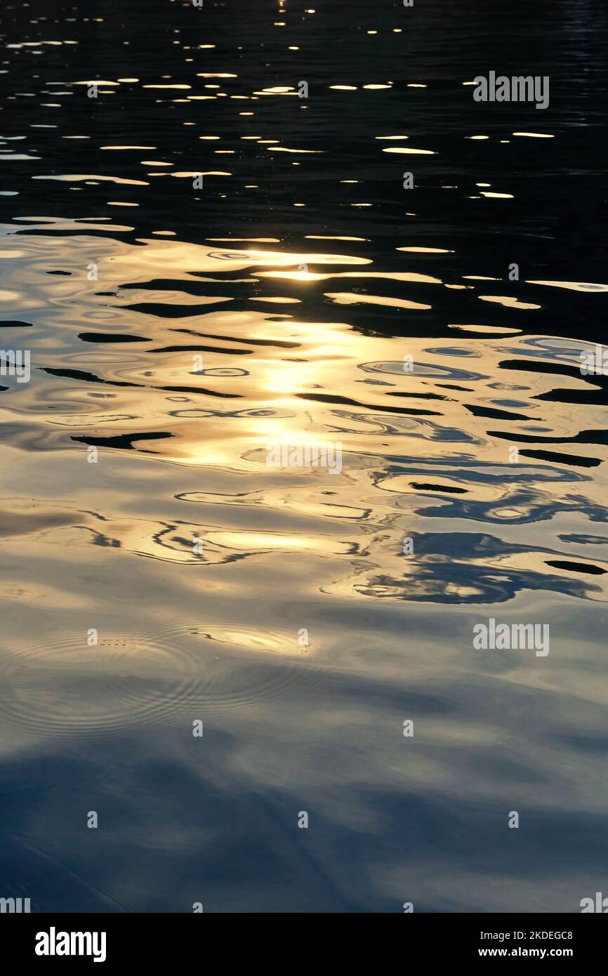 Sunset sun reflection on a wavy sea water. Abstract nature backgrounds ...
