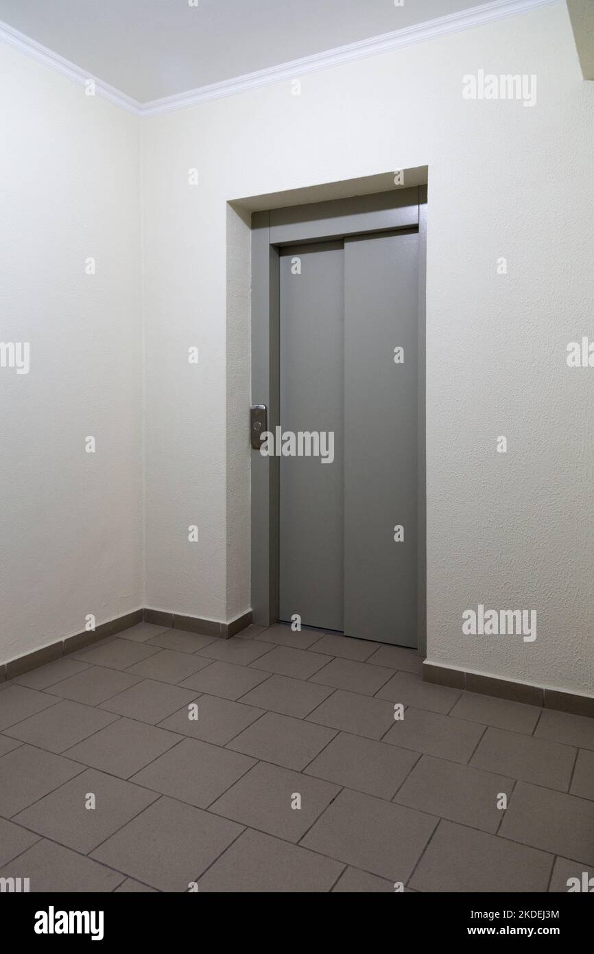 Door of lift in a modern building. The image is vertical. Close-up ...