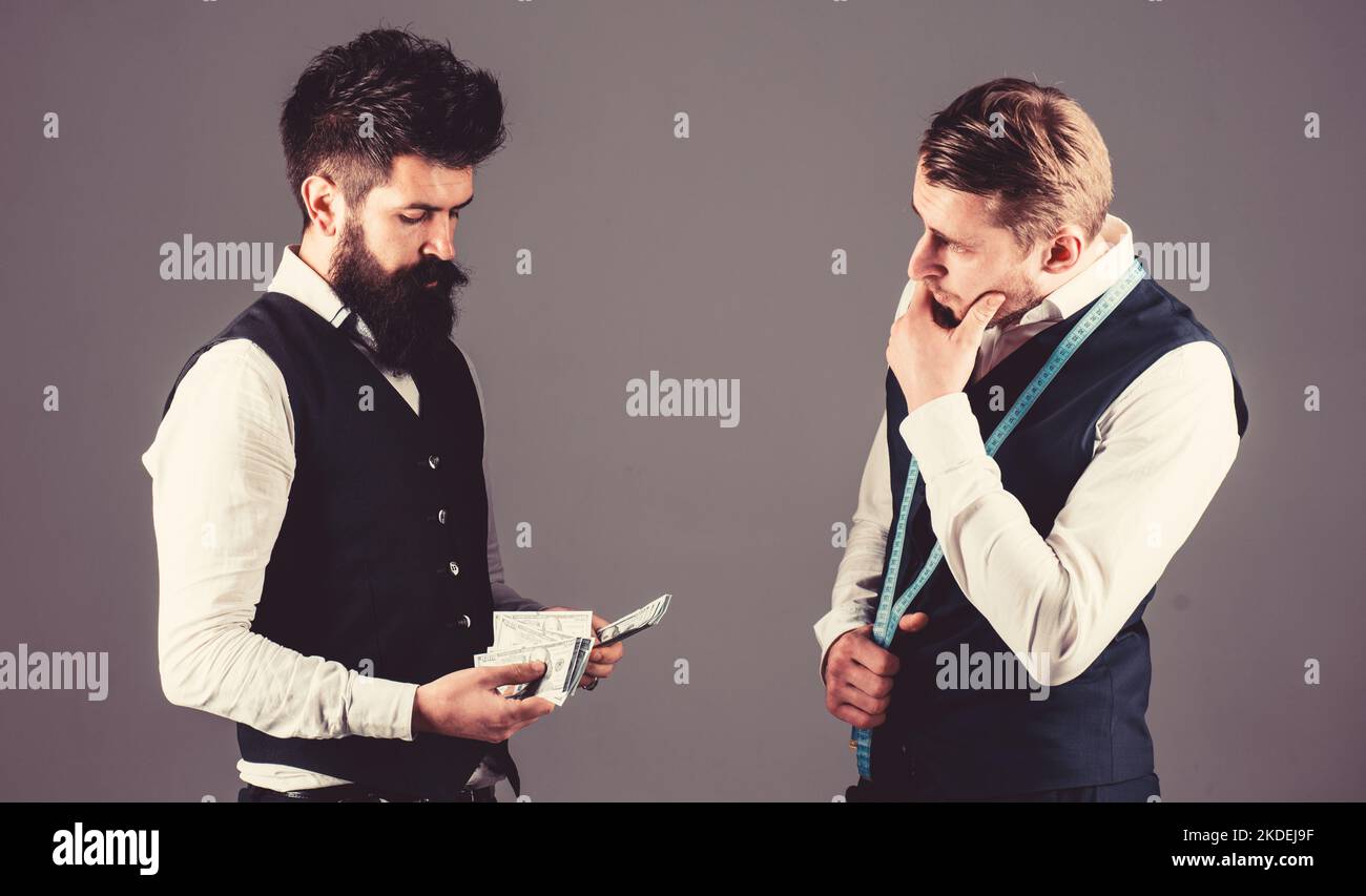 Customer, client paying, counting money, grey background Stock Photo ...