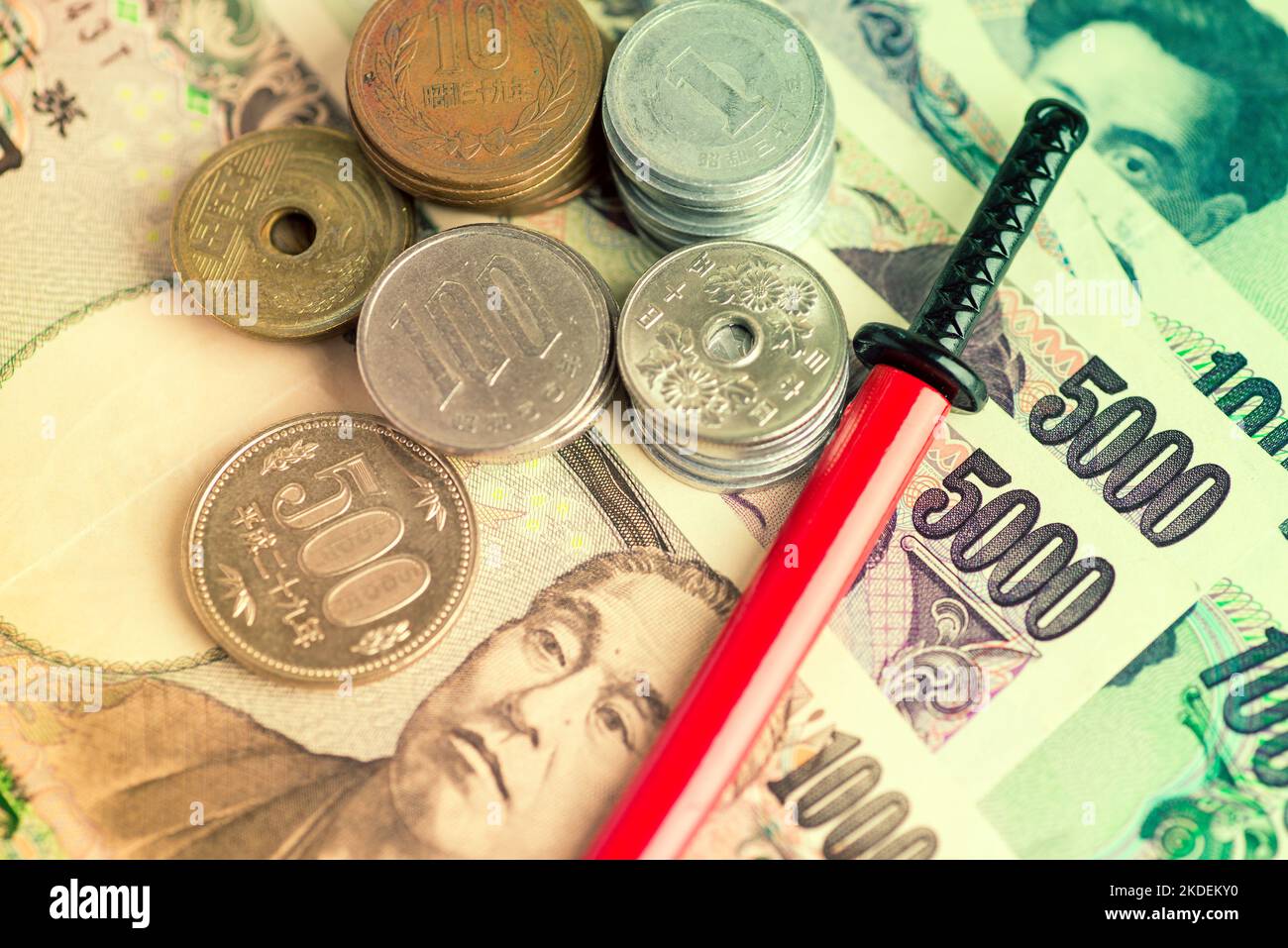 Toned illustrative editorial of Japanese Yen in notes and coins and a ...