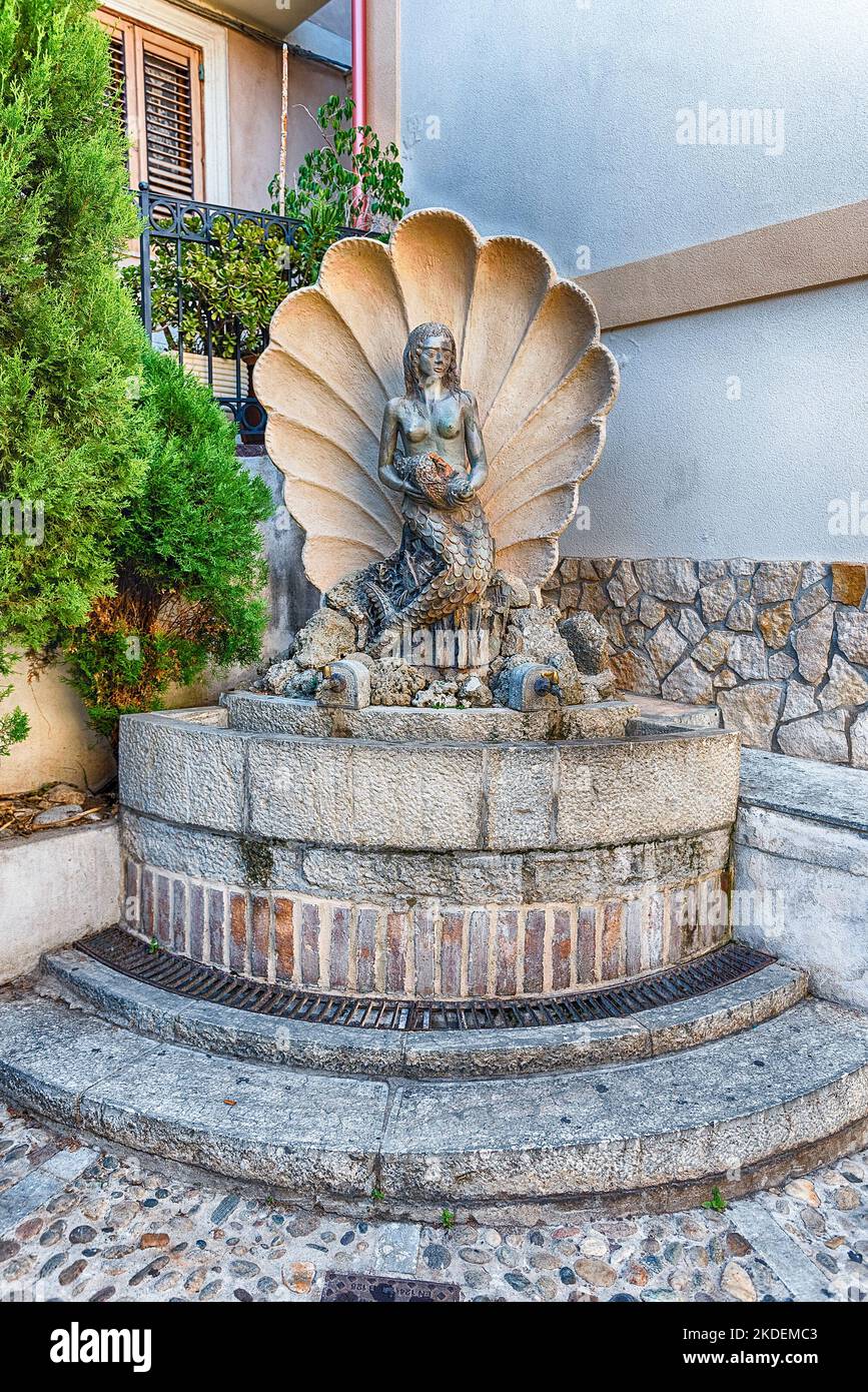 Scenic fountain in the seaside village of Chianalea, fraction of Scilla ...