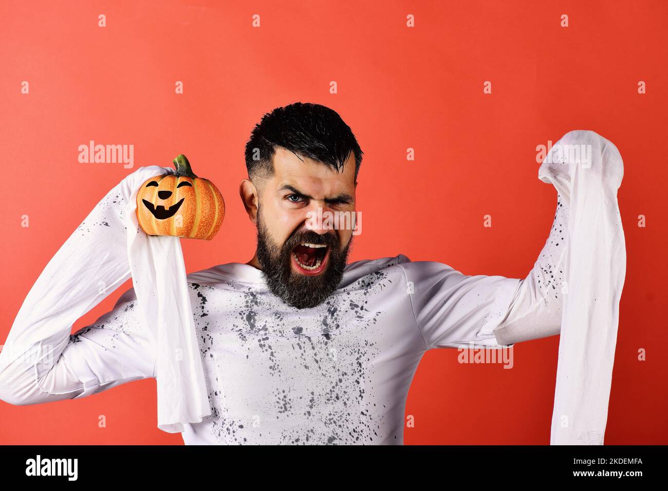 Man with mad face expression on red background. Halloween character ...