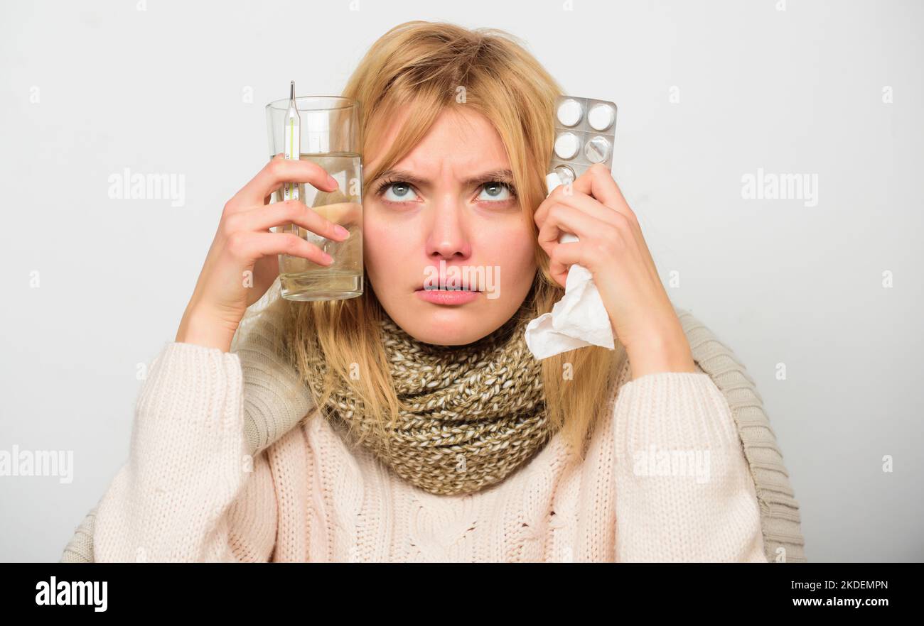 Flu home remedies. Woman wear warm scarf because illness or flu. Girl ...