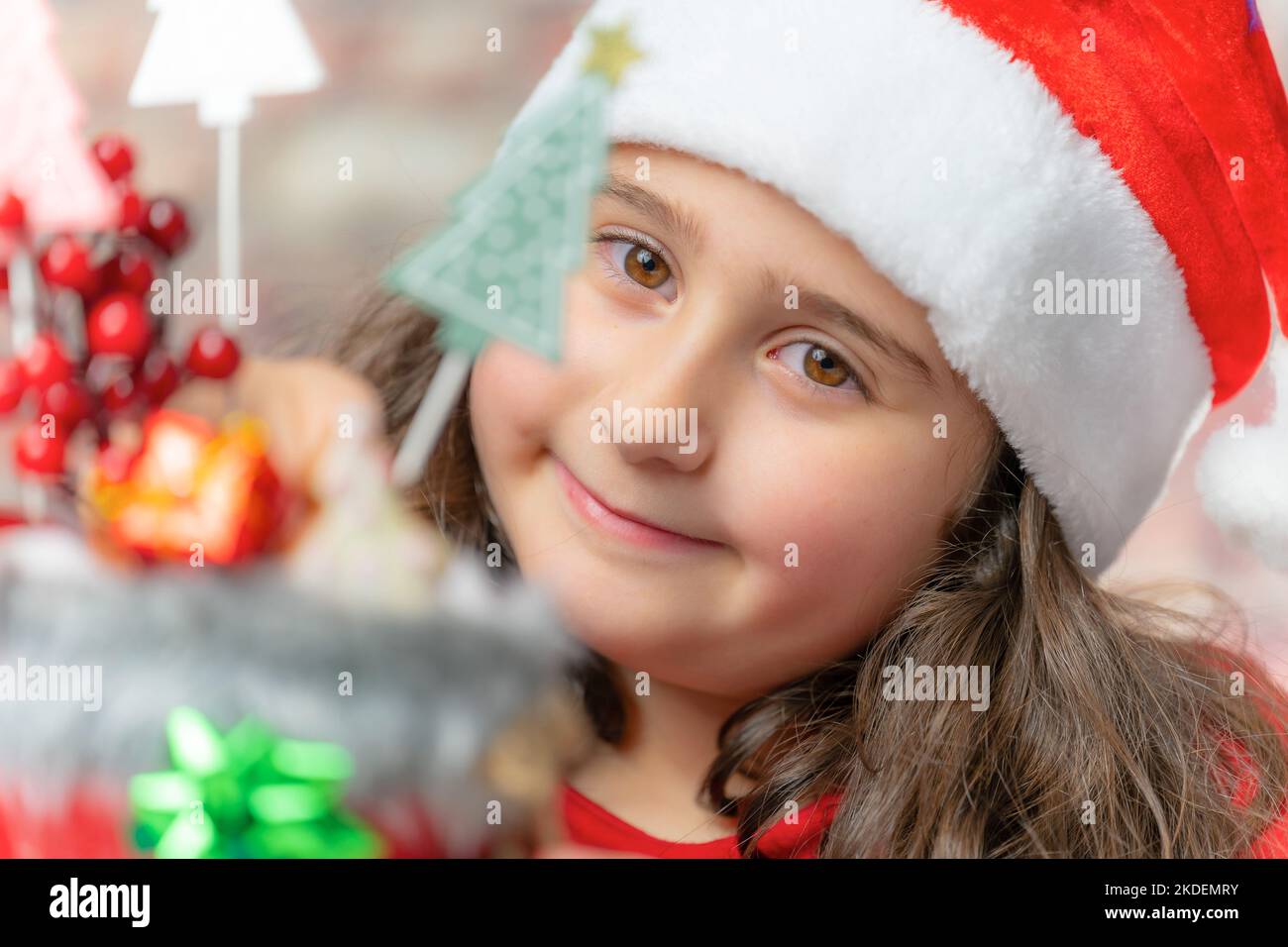 Child in Santa red cloth with red Santa boot Stock Photo - Alamy