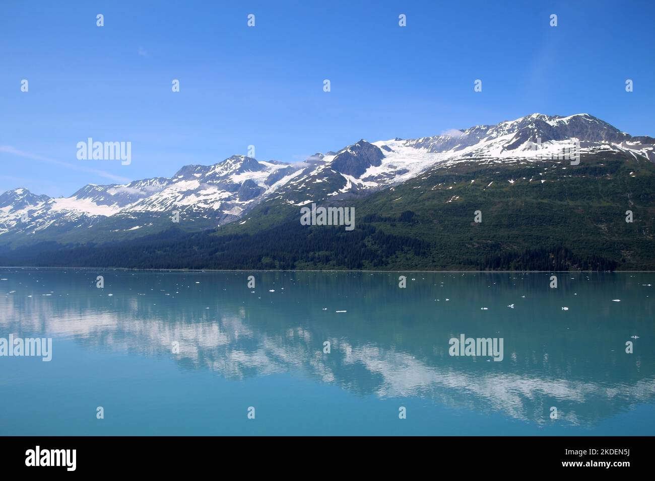Mountain range reflected in College Fjord the northern sector of Prince ...