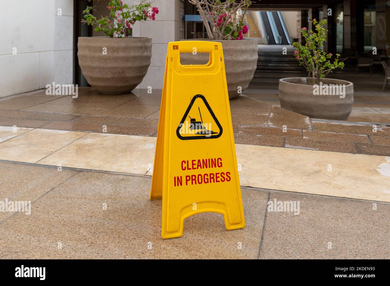 Sign showing warning of caution wet floor Stock Photo - Alamy