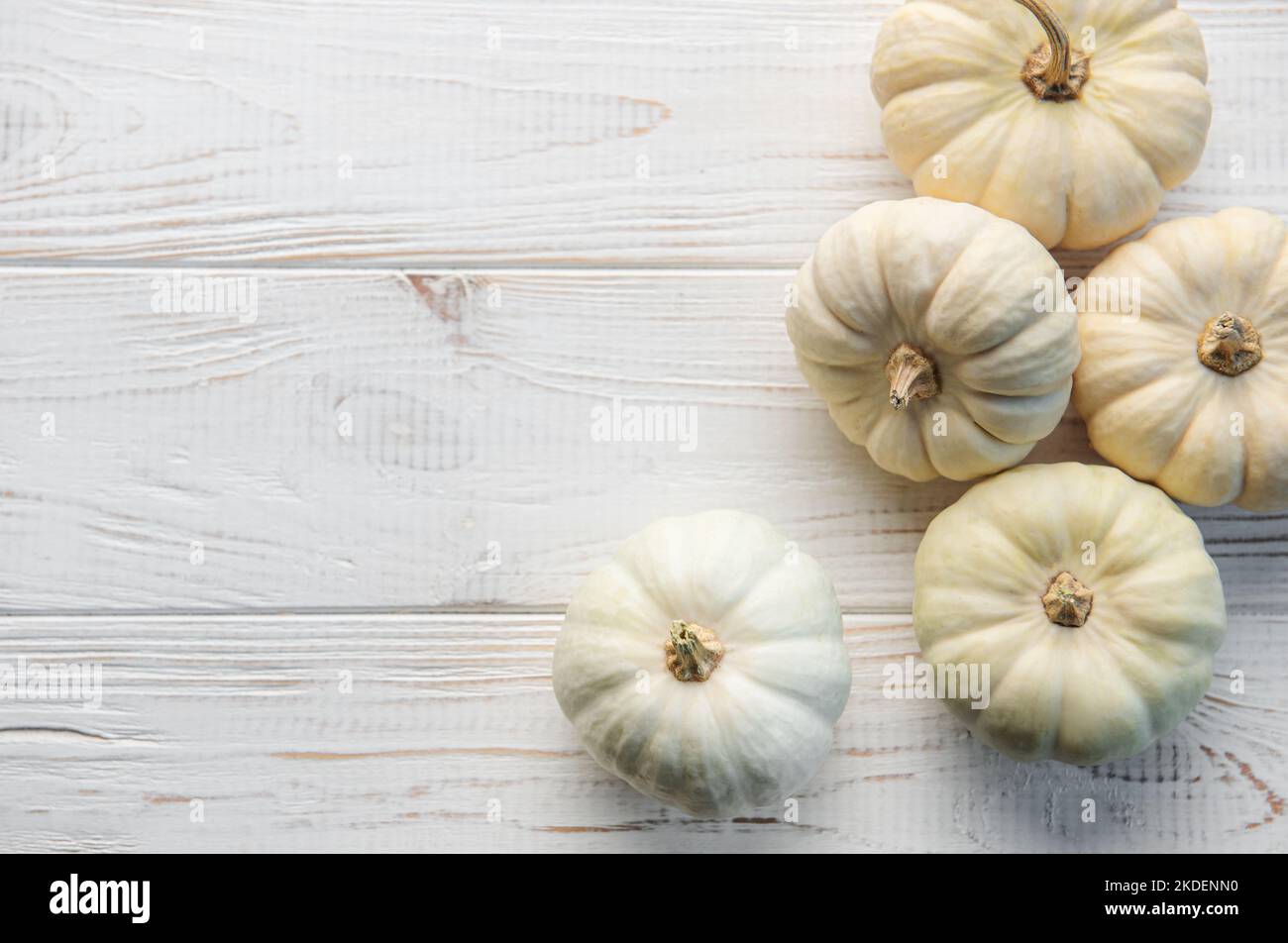 Thanksgiving or harvest flatlay with pumpkins on white wooden ...