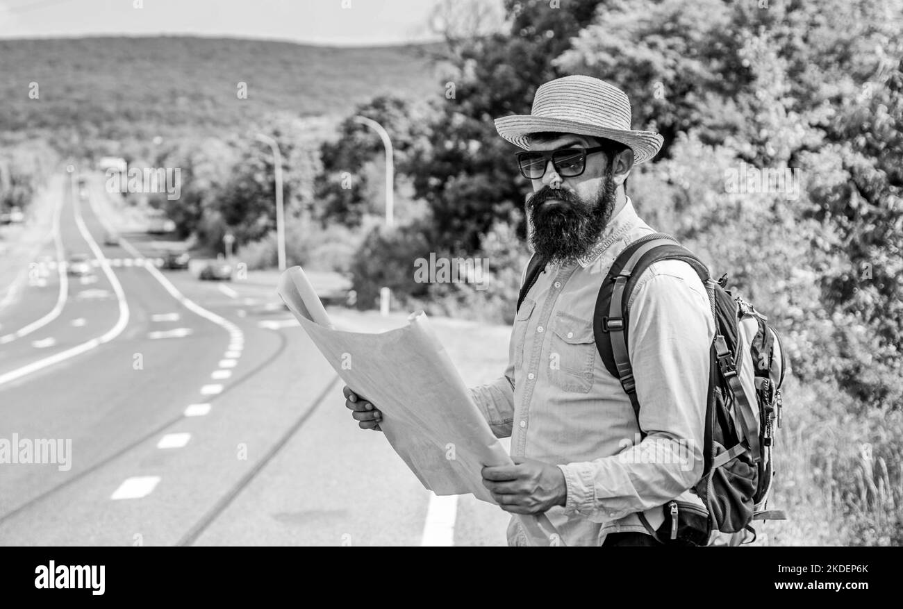 Carry good map. Tourist backpacker looks at map choosing travel ...
