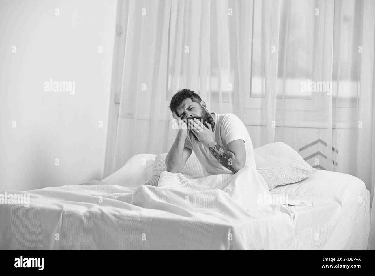 Guy on sleepy tired face yawning. Macho with beard and mustache yawning ...