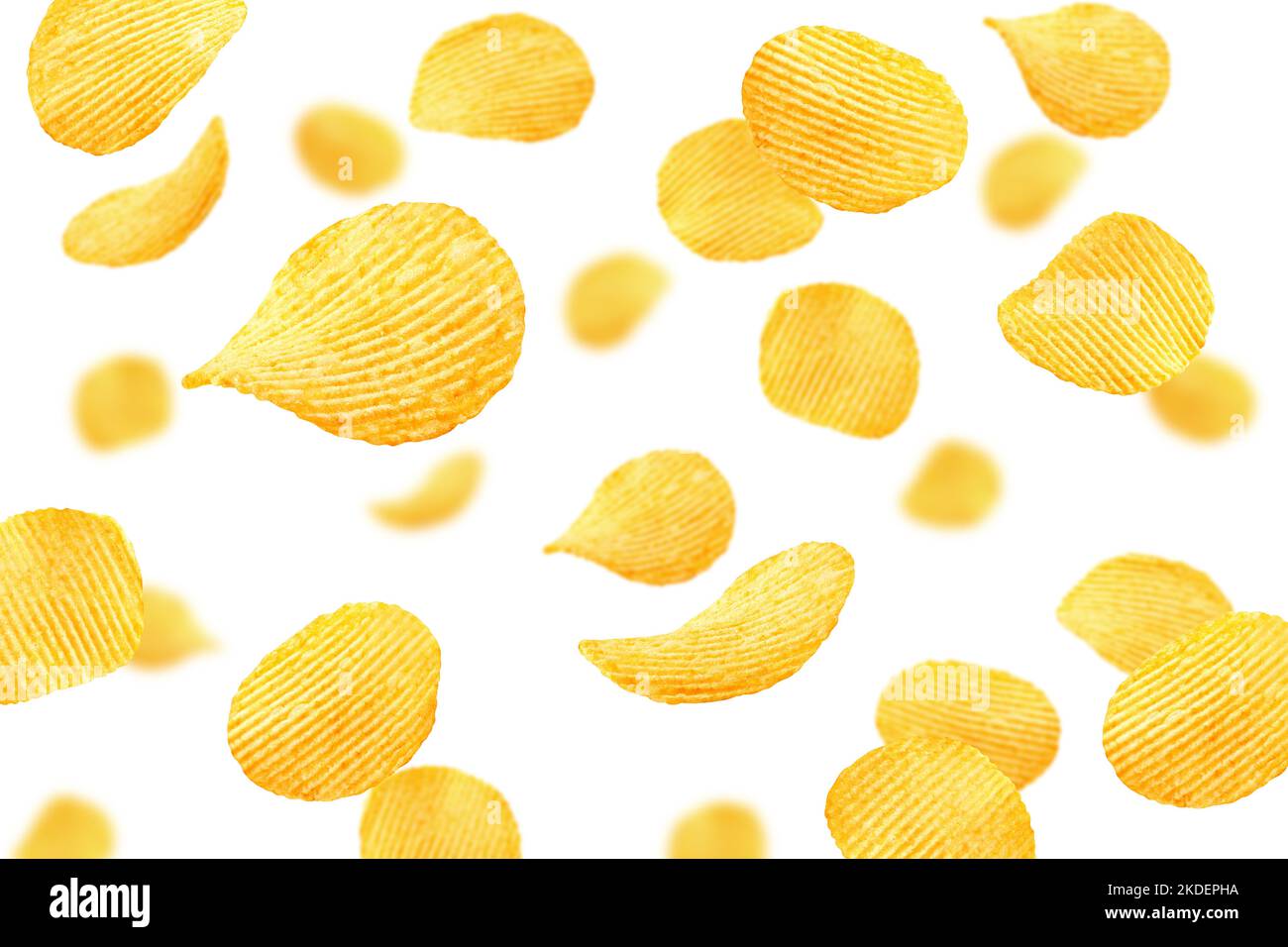 Falling potato chips isolated on white background, selective focus ...