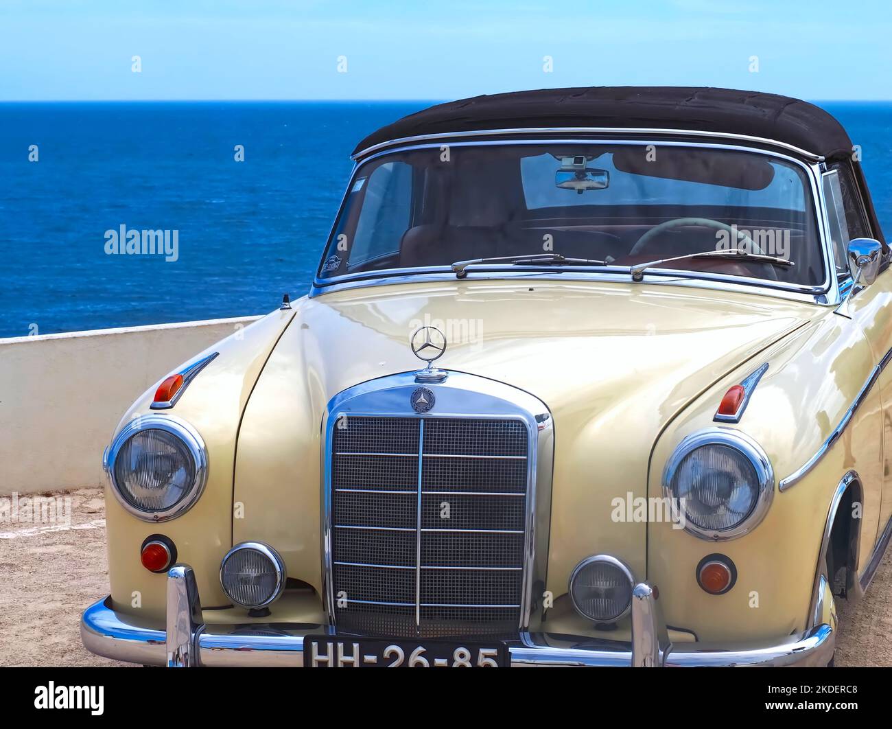 Mercedes Benz cabriolet convertible oldtimer car in front of blue ocean ...