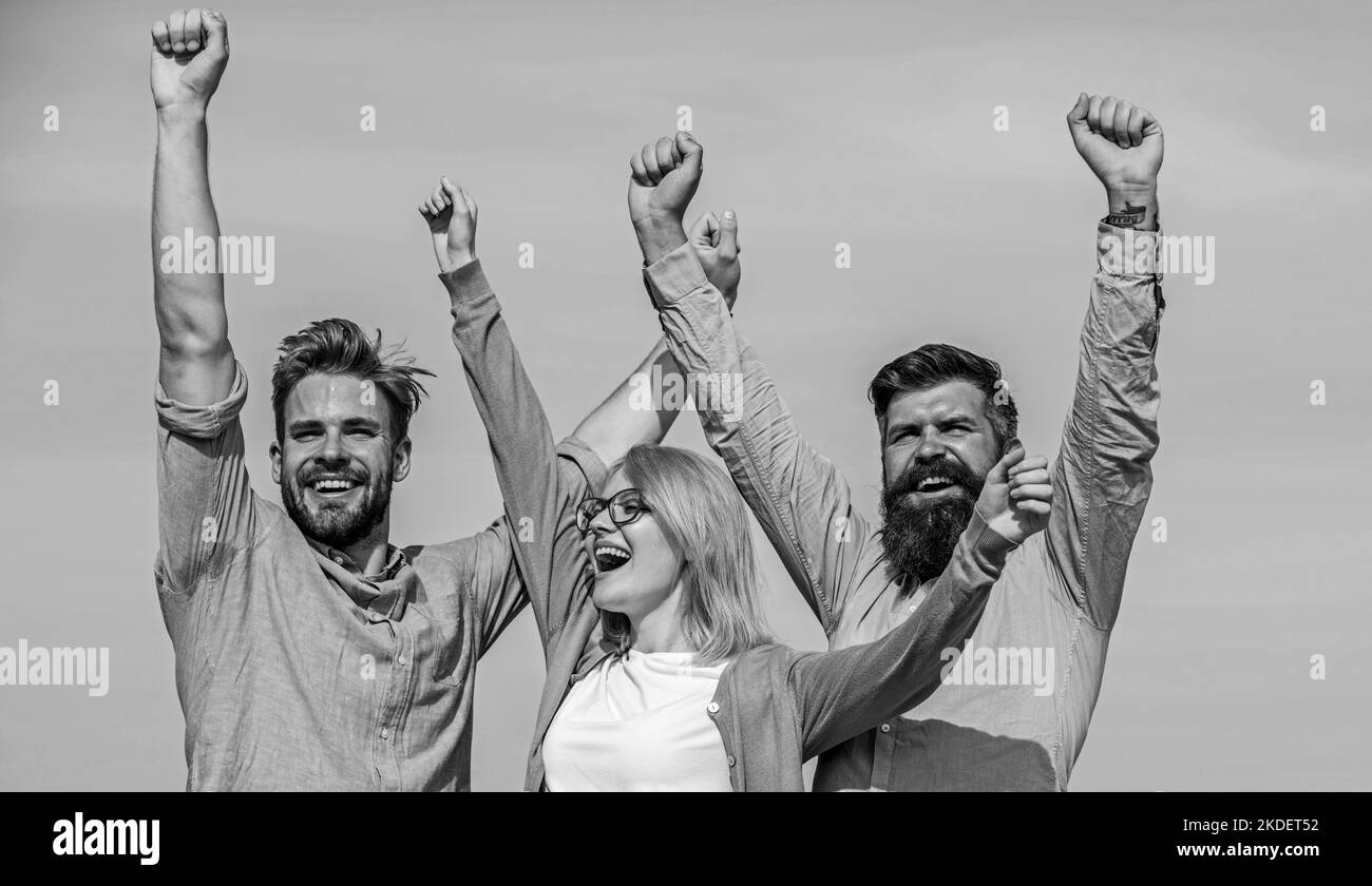 Company three happy colleagues office workers enjoy freedom, sky ...