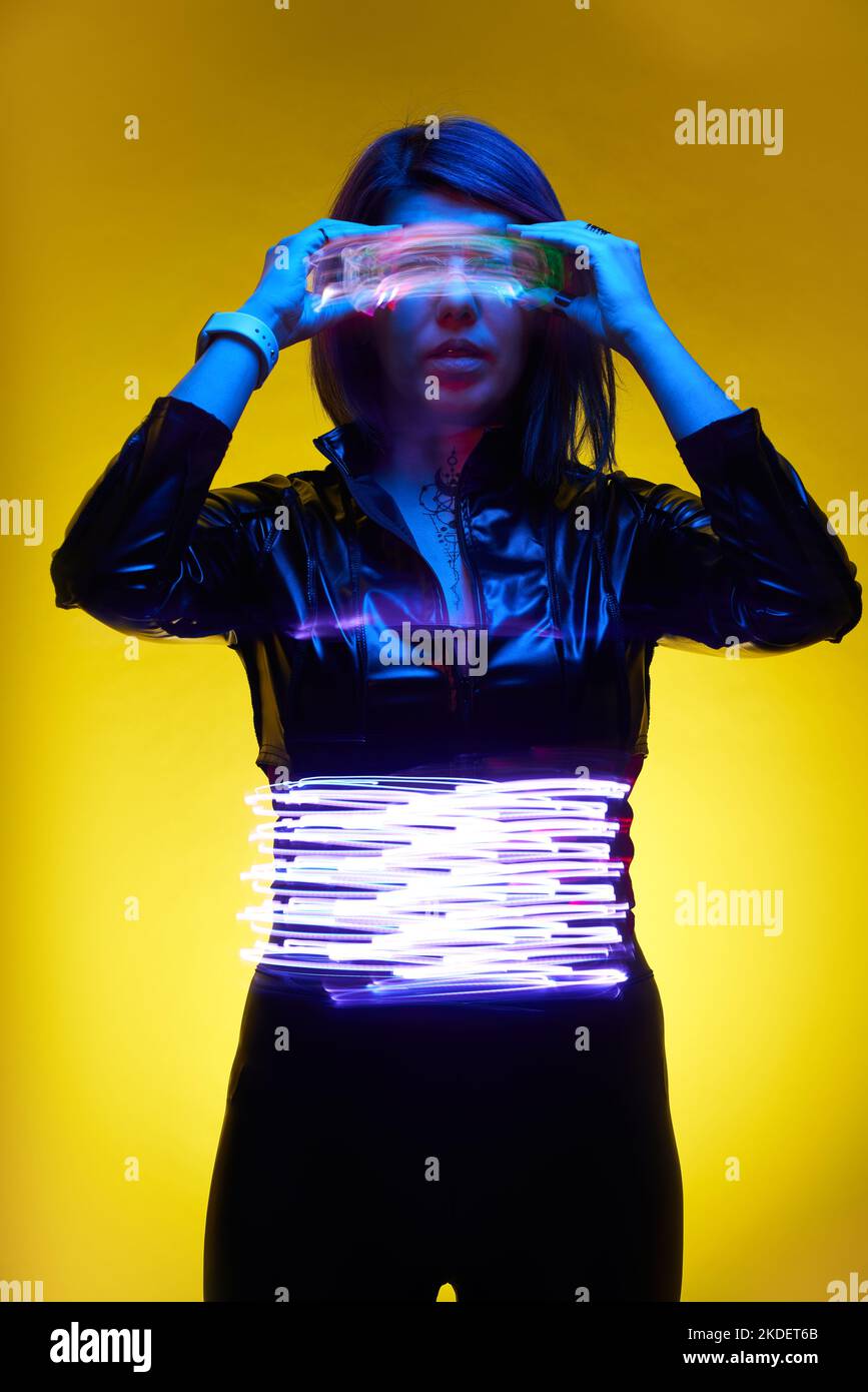 Woman is using augmented reality headset. Concept of virtual, augmented ...