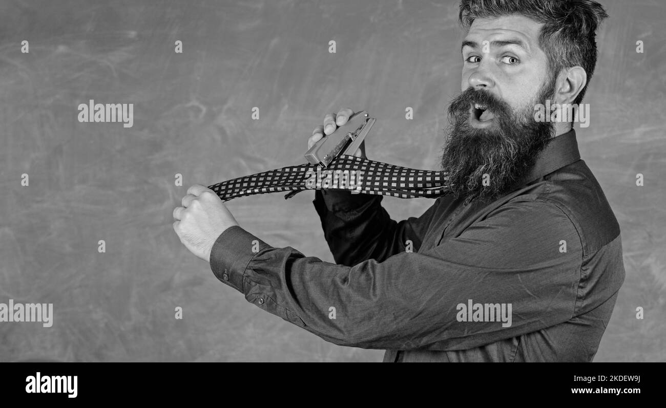 Man scruffy use stapler dangerous way. Hipster teacher formal wear ...