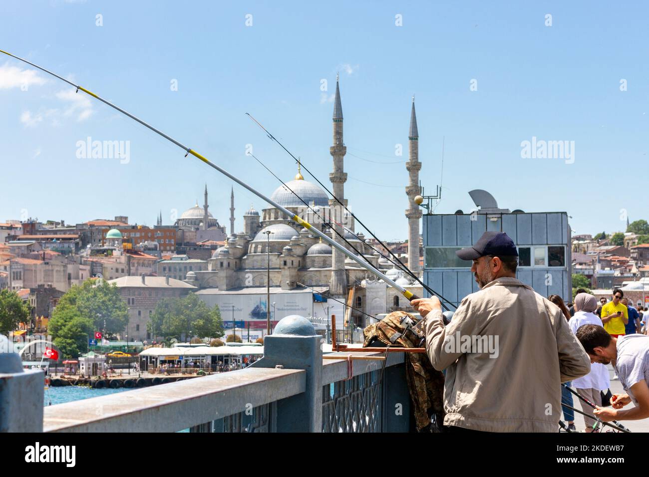 Local fishermen with their fishing lines, on the Galata bridge in ...