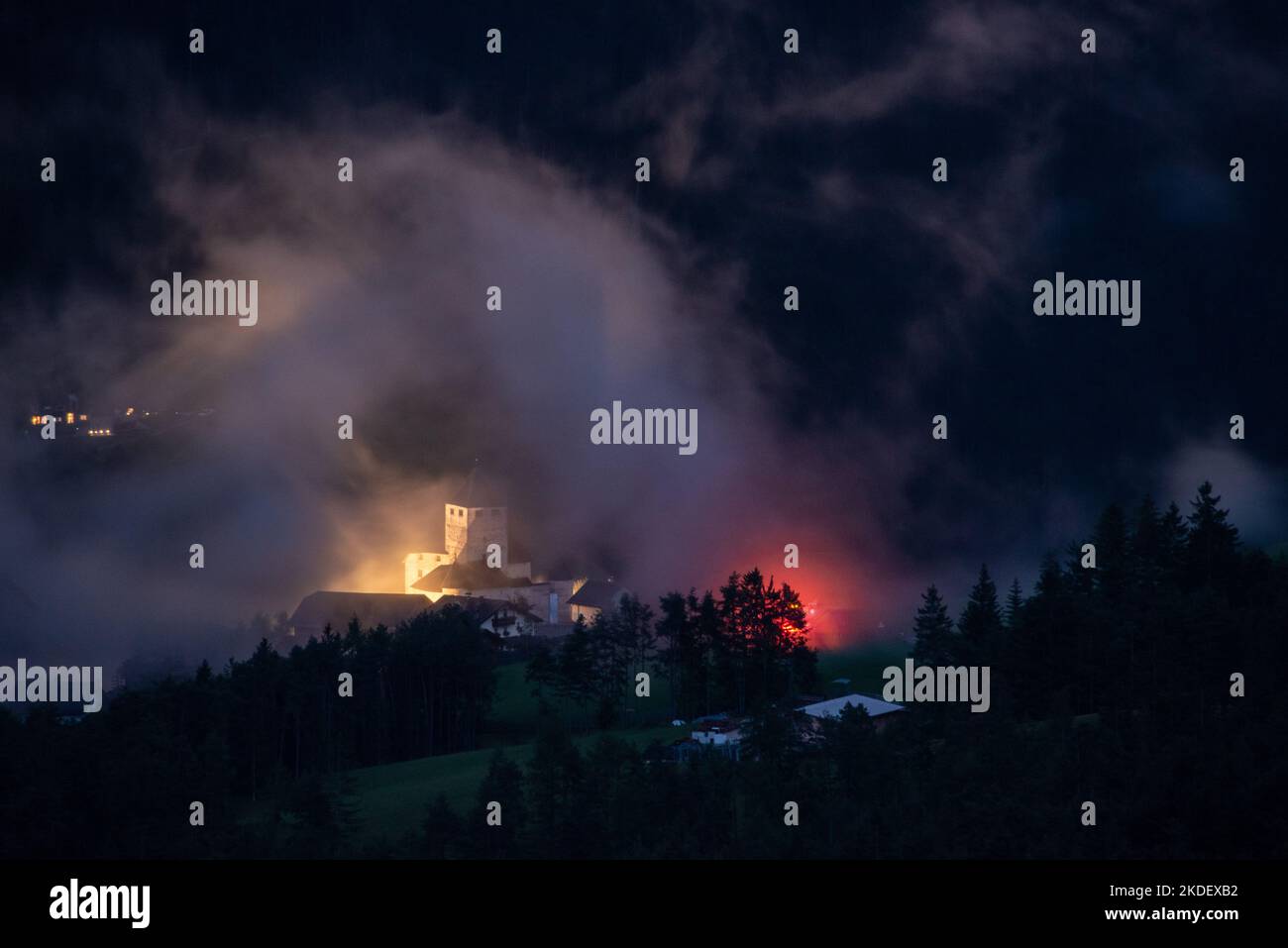 Spooky mediaeval castle in St. Martin in Thurn, hidden behind low ...