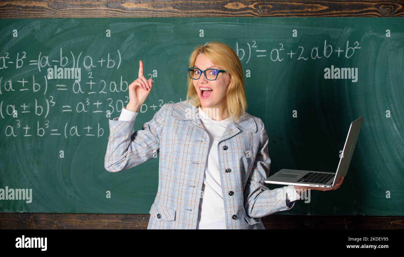 Educator smart clever lady with modern laptop searching information ...