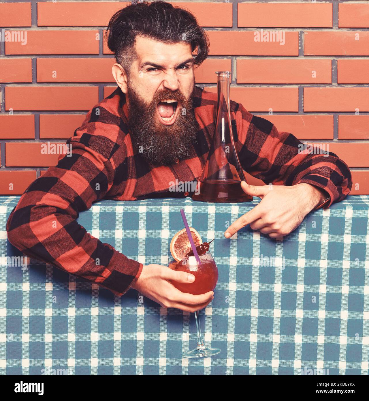 Barman advice concept. Barman with beard on shouting face holds ...