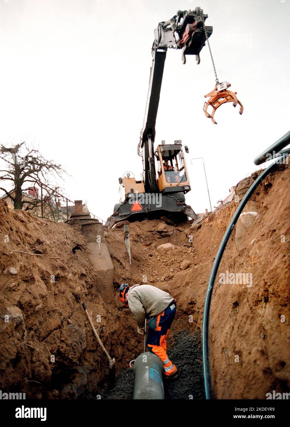 A business in a municipality. Excavation in a street for new pipes and ...