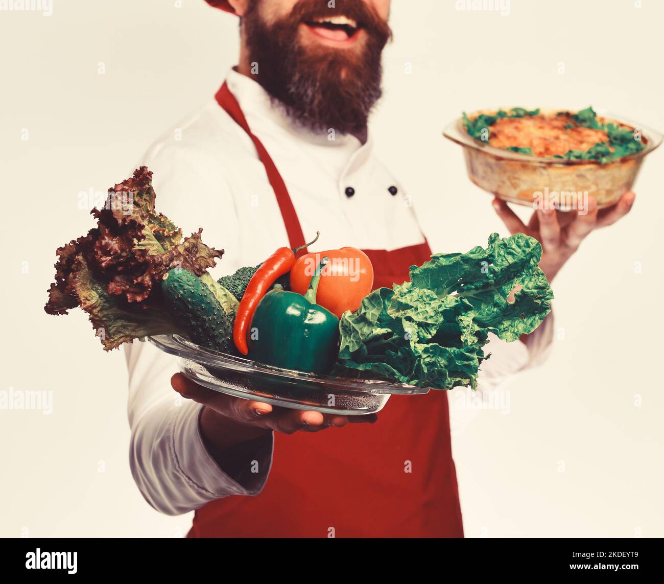 Cooking and vegetarian diet concept. Cook with smile Stock Photo - Alamy